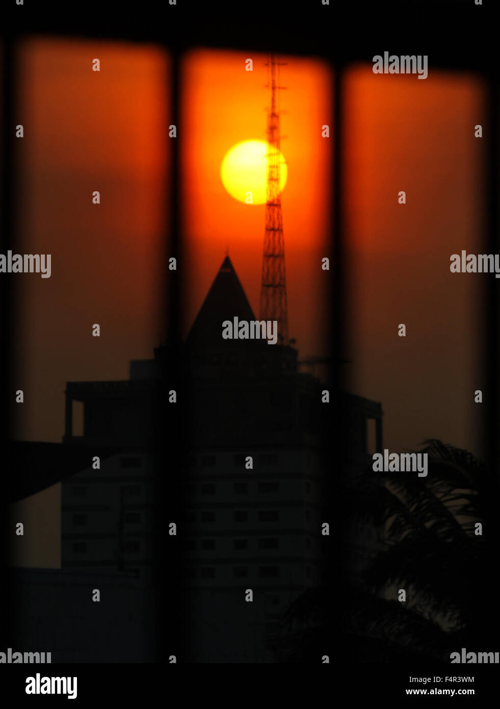 Views of the sun between buildings in the city of Jakarta, Indonesia ...