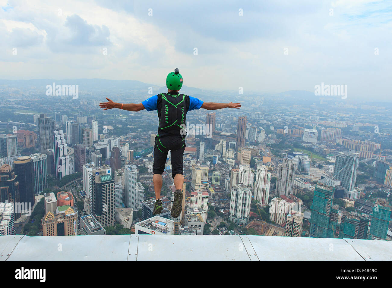 Kuala Lumpur, Malaysia-September 30, 2011: A BASE jumpers in jumps off ...