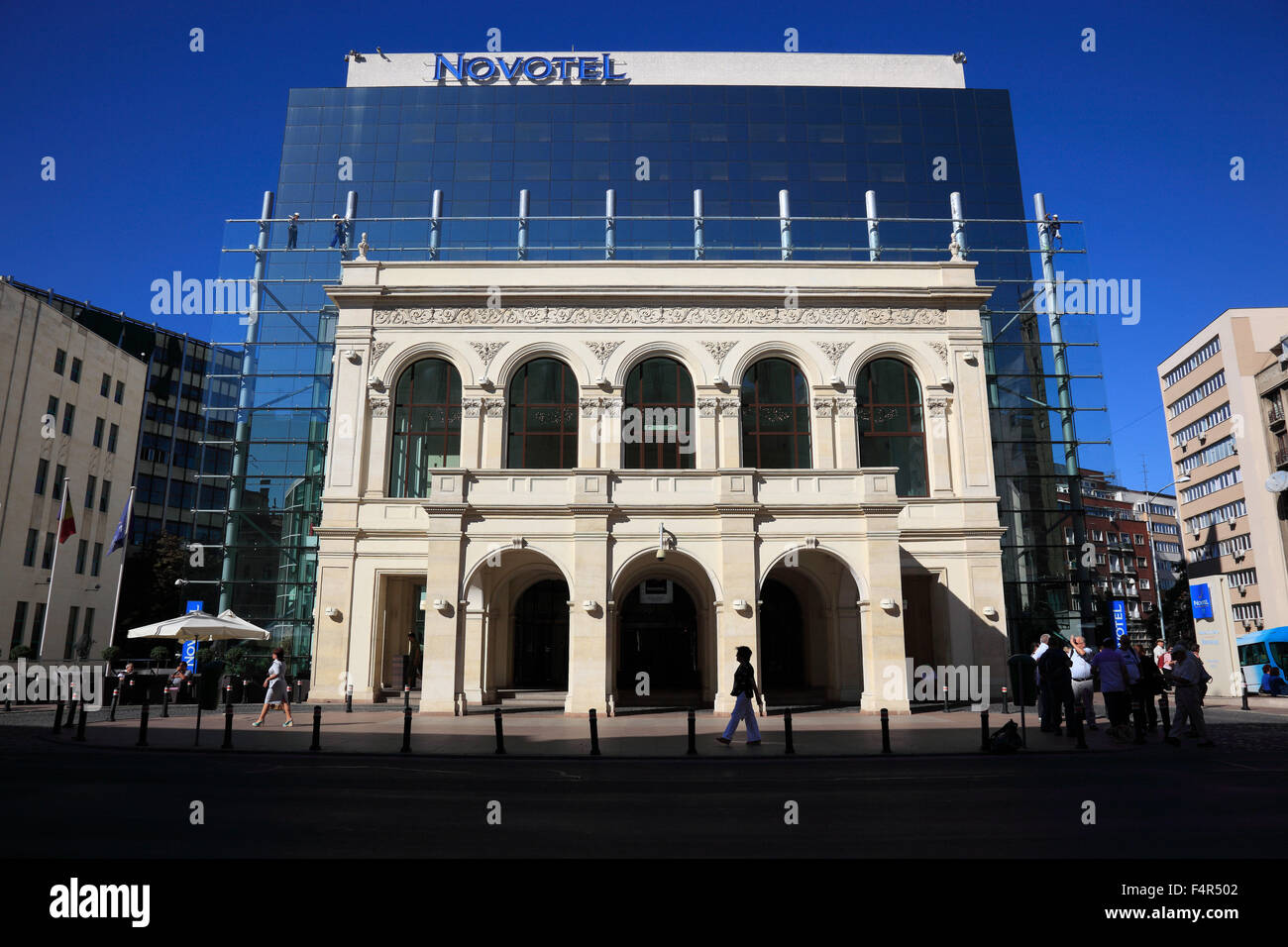 Hotel Novotel, modern glass facade building and the facade of a ...