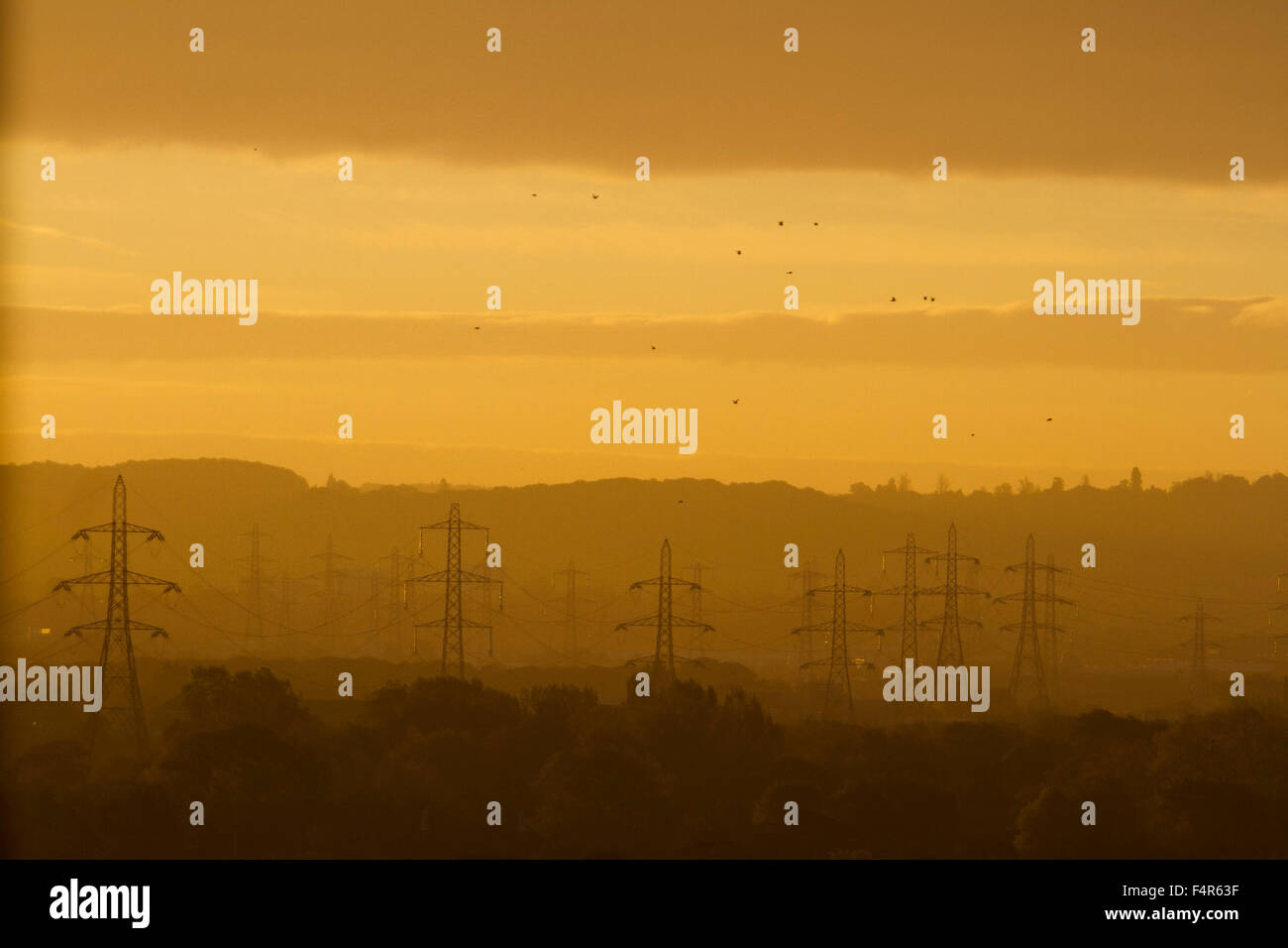 London, UK. 22nd Oct, 2015. Electricity pylons rise during a colourful ...