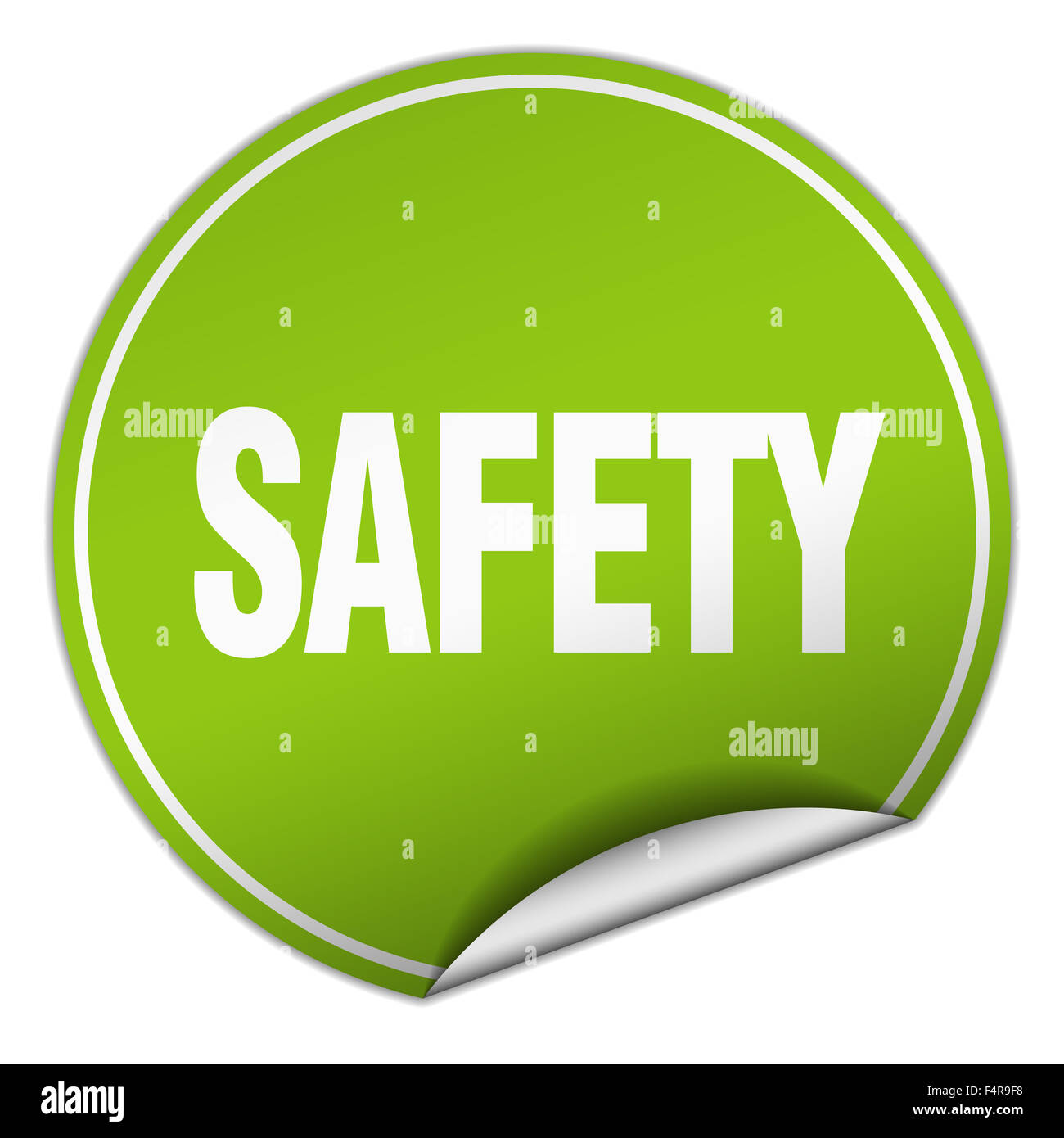 safety round green sticker isolated on white Stock Photo - Alamy