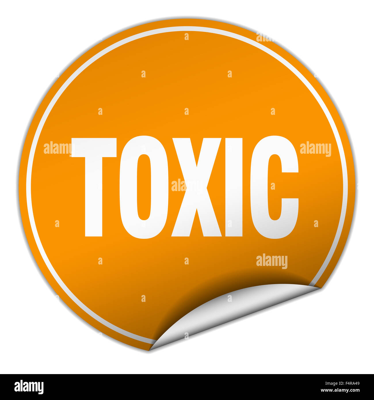 toxic round orange sticker isolated on white Stock Photo - Alamy