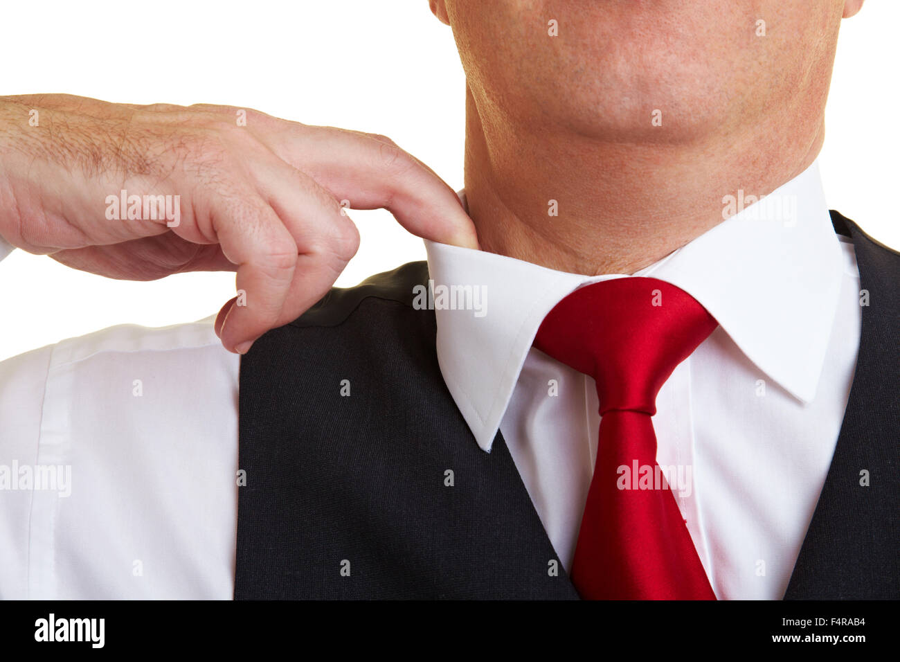 Businessman lifting the collar with his finger Stock Photo - Alamy