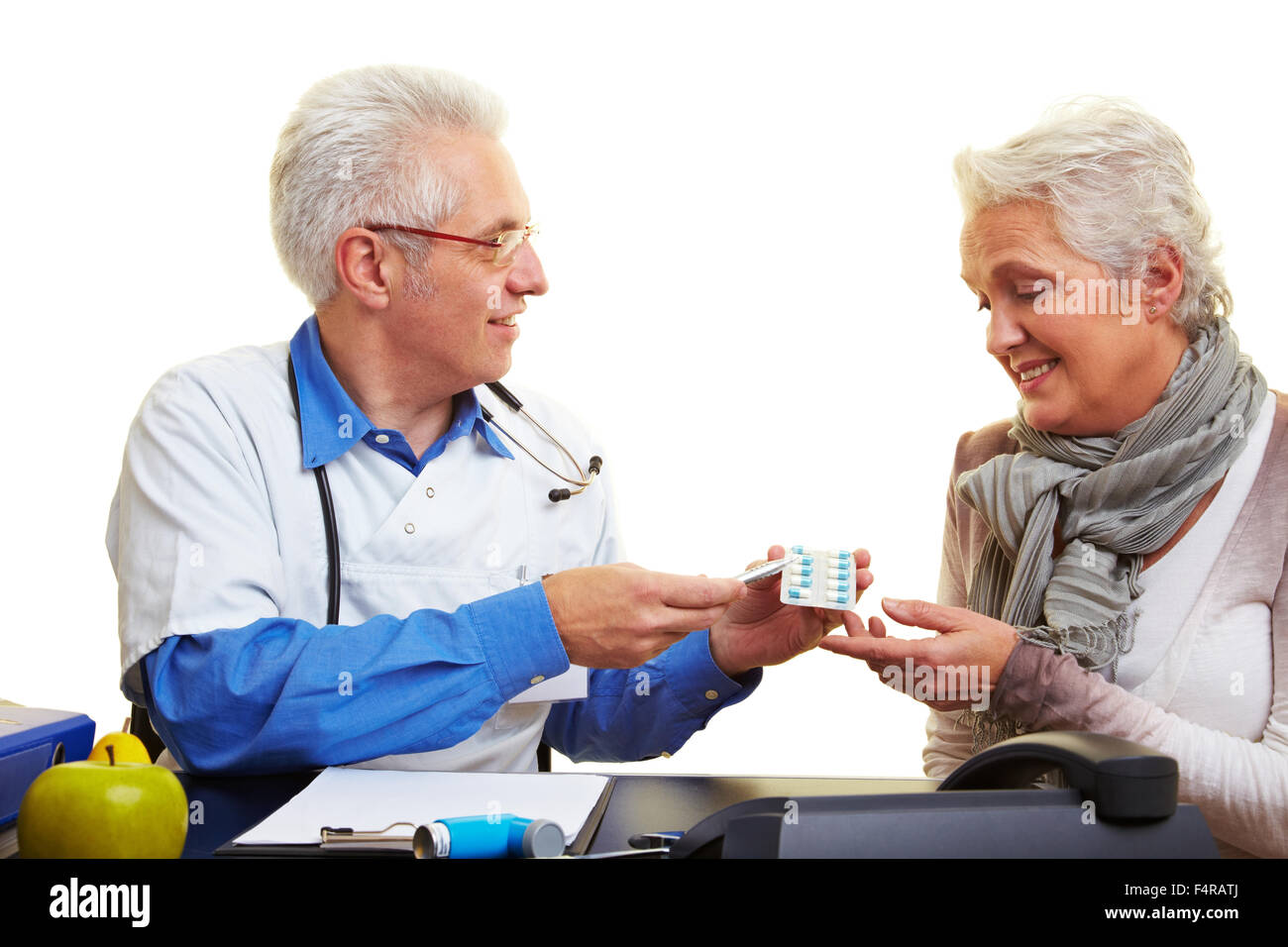 A doctor giving senior citizen medikation Stock Photo - Alamy