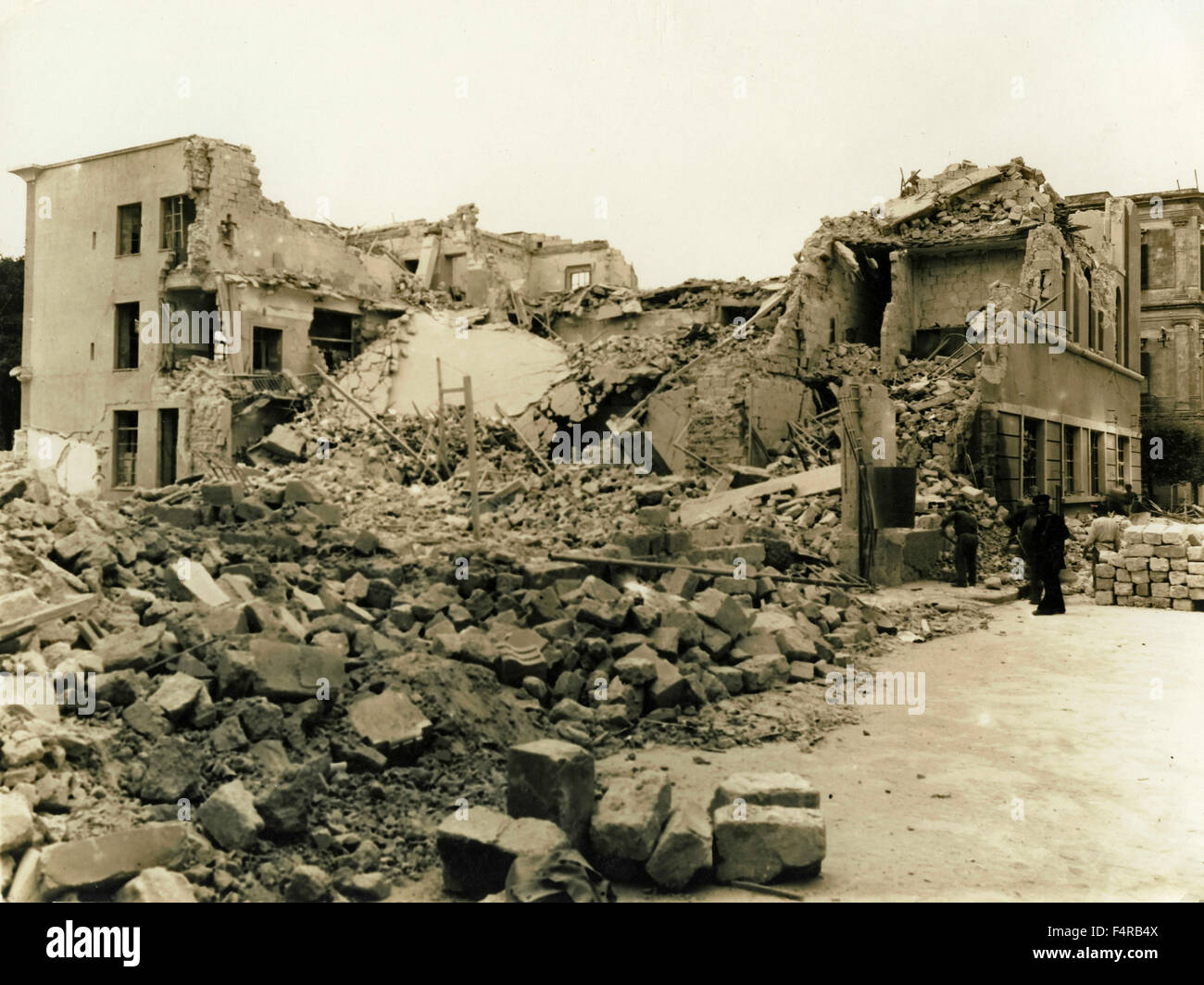 Trying to rebuild after the bombing Stock Photo - Alamy