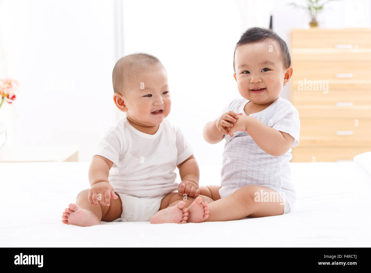 Two cute baby Stock Photo - Alamy