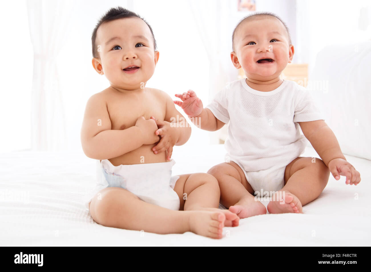 Two cute baby Stock Photo - Alamy