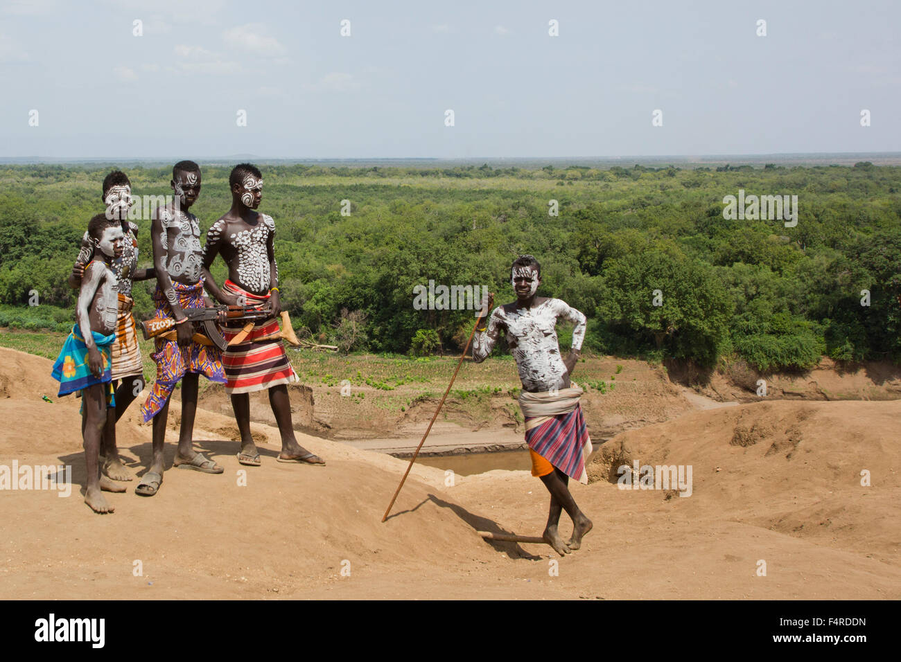 A group of young Karo tribe boys with AK-47 rifle . Omo Valley ...
