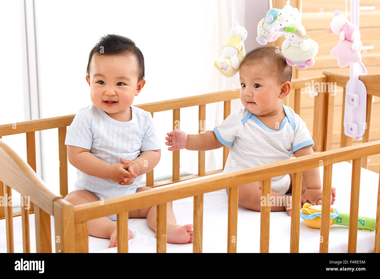 Two cute baby Stock Photo - Alamy