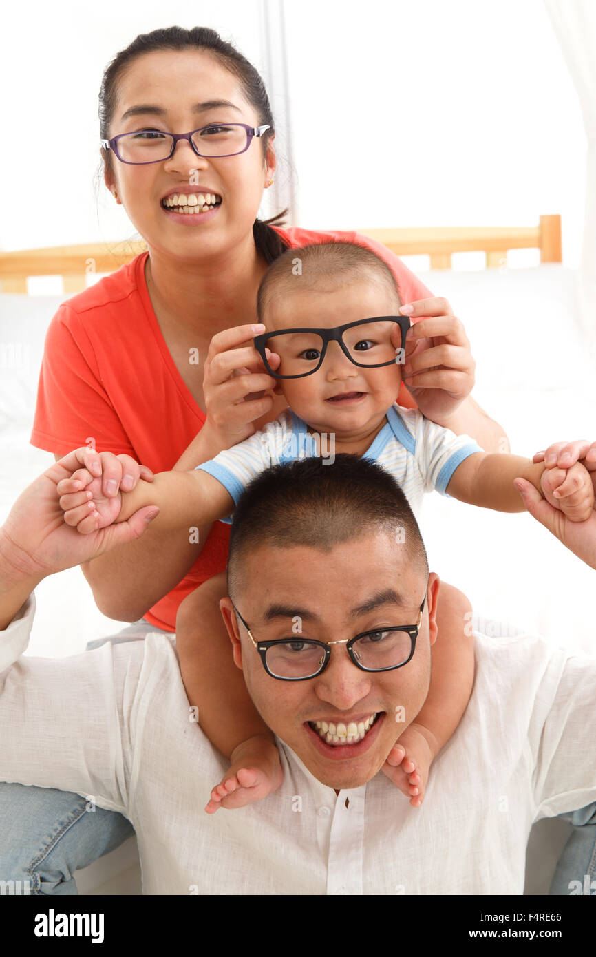 Happy family three Stock Photo - Alamy