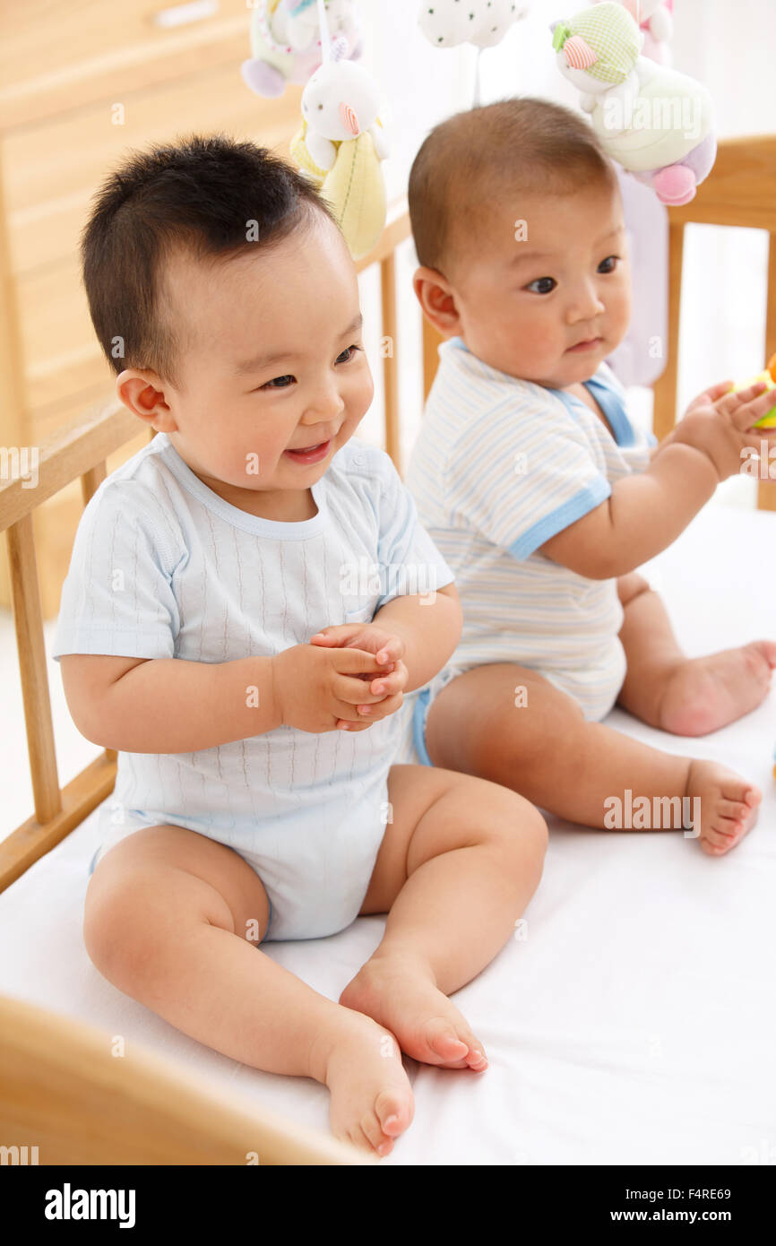 Two cute baby Stock Photo - Alamy