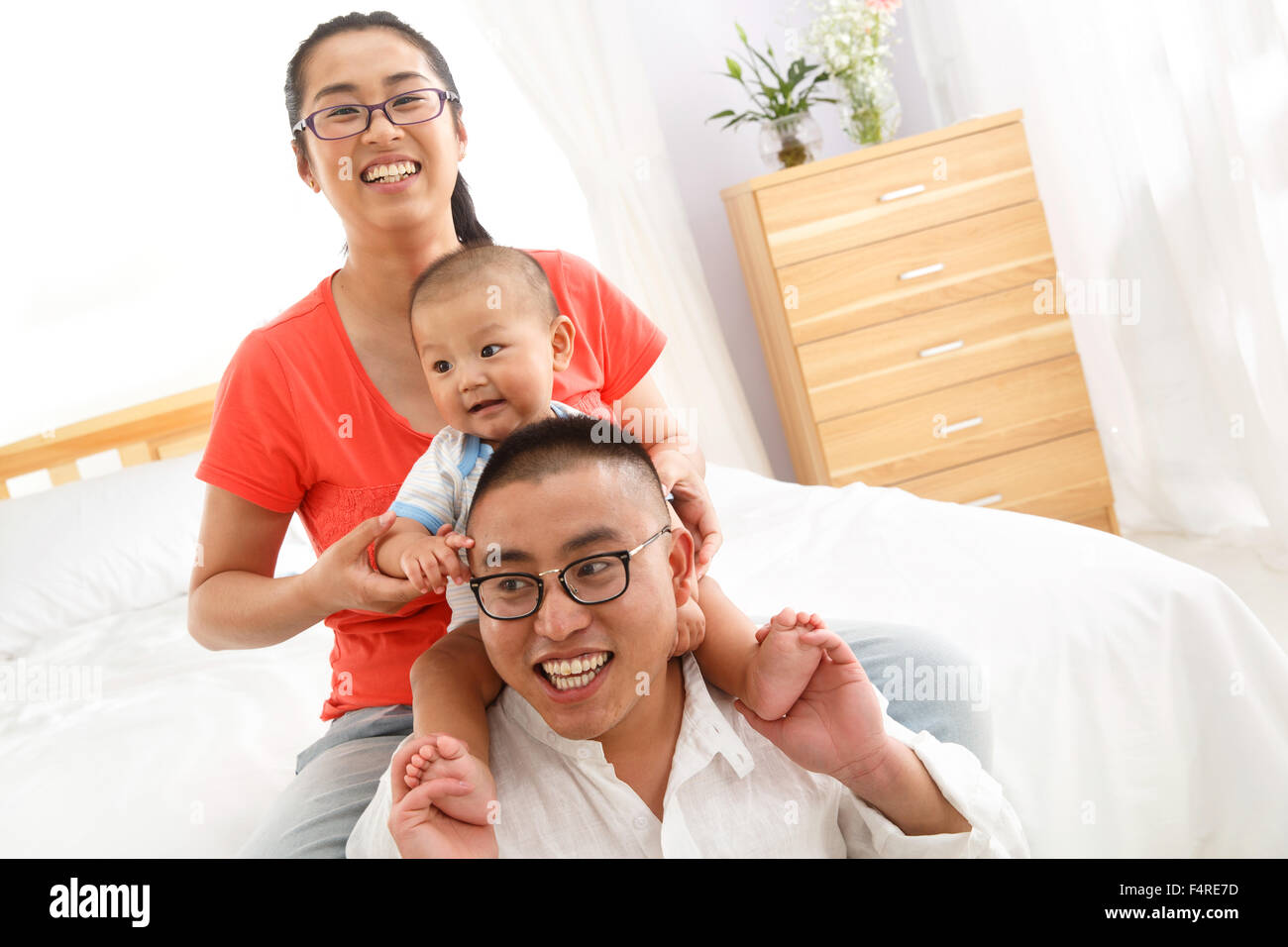 Happy family three Stock Photo - Alamy