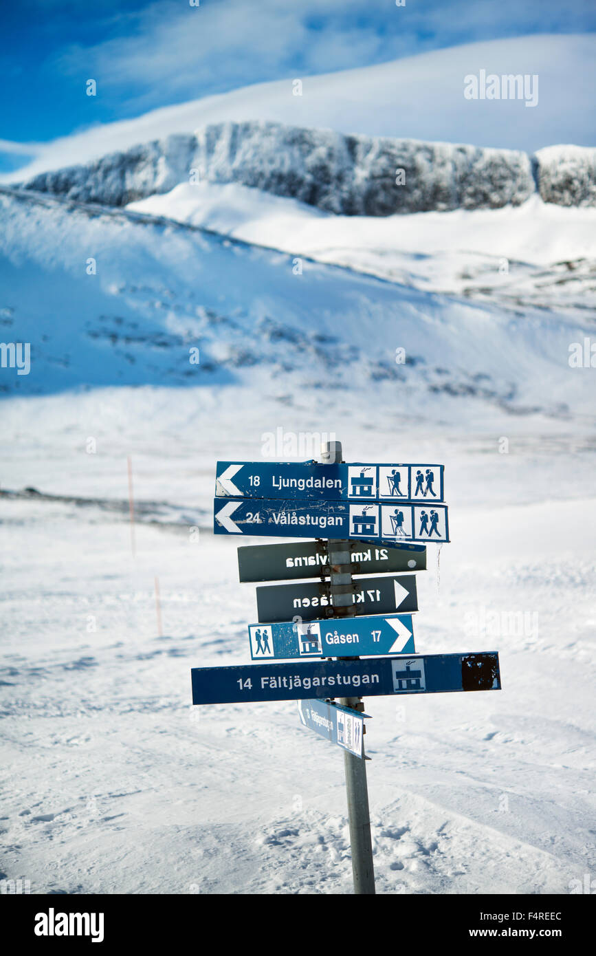 Directional sign in winter landscape Stock Photo - Alamy