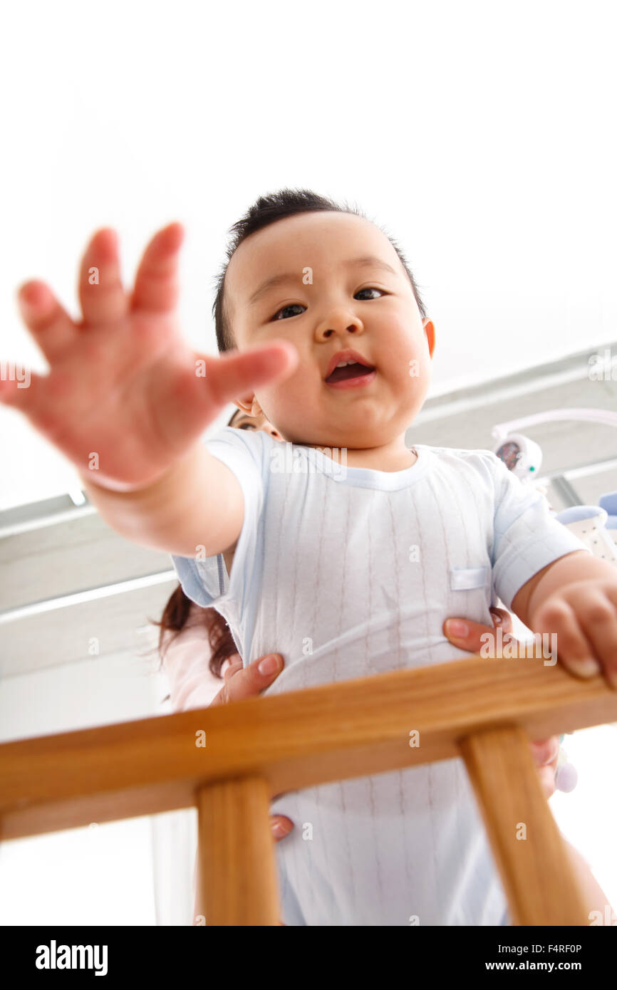 Baby reaching for adult hand hi-res stock photography and images - Alamy