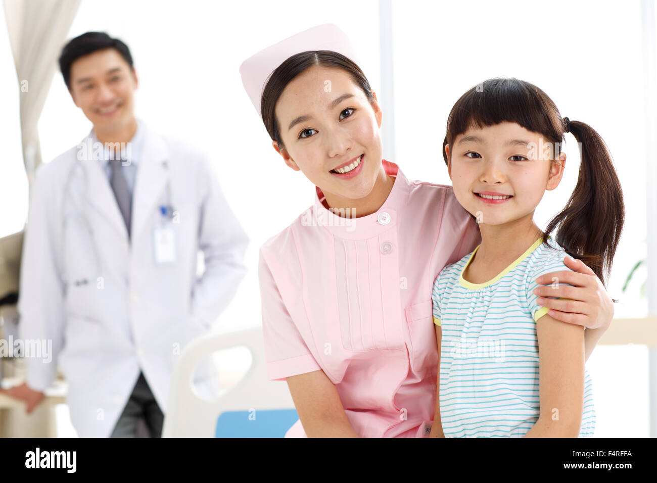 Health care workers and girls Stock Photo - Alamy