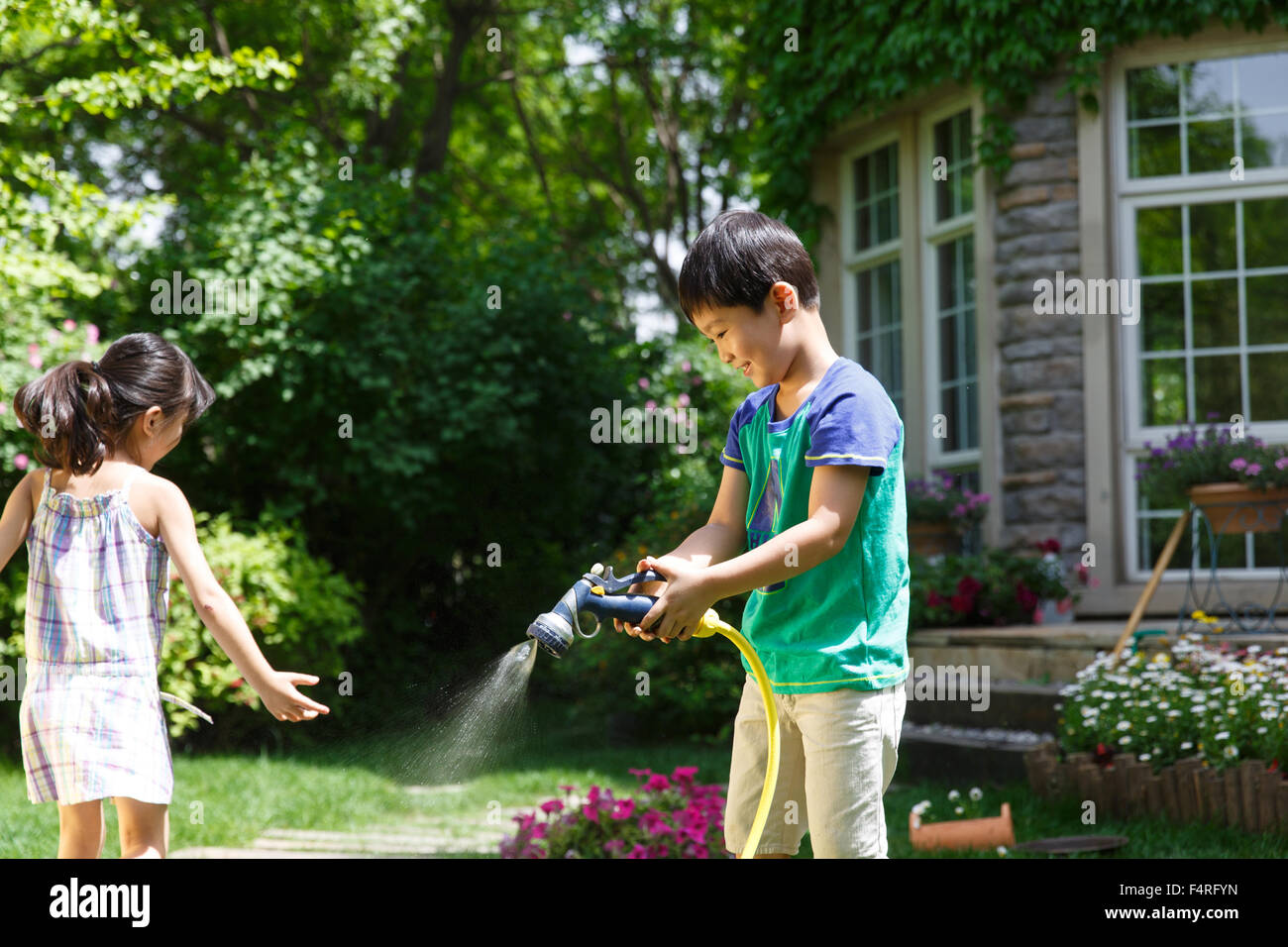 Children playing in courtyard hi-res stock photography and images - Alamy