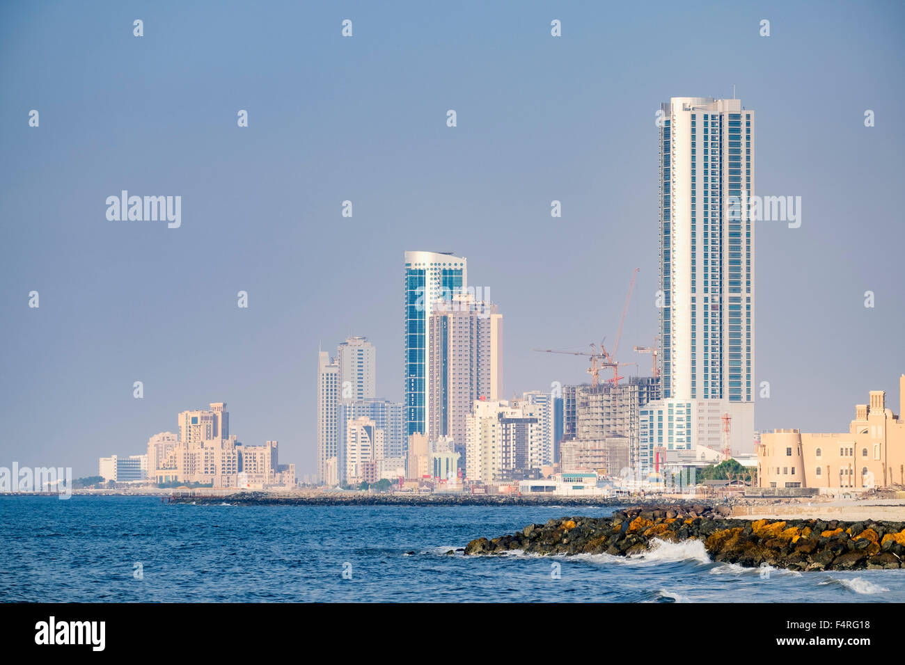 View of skyline along Corniche waterfront of Ajman emirate in United ...
