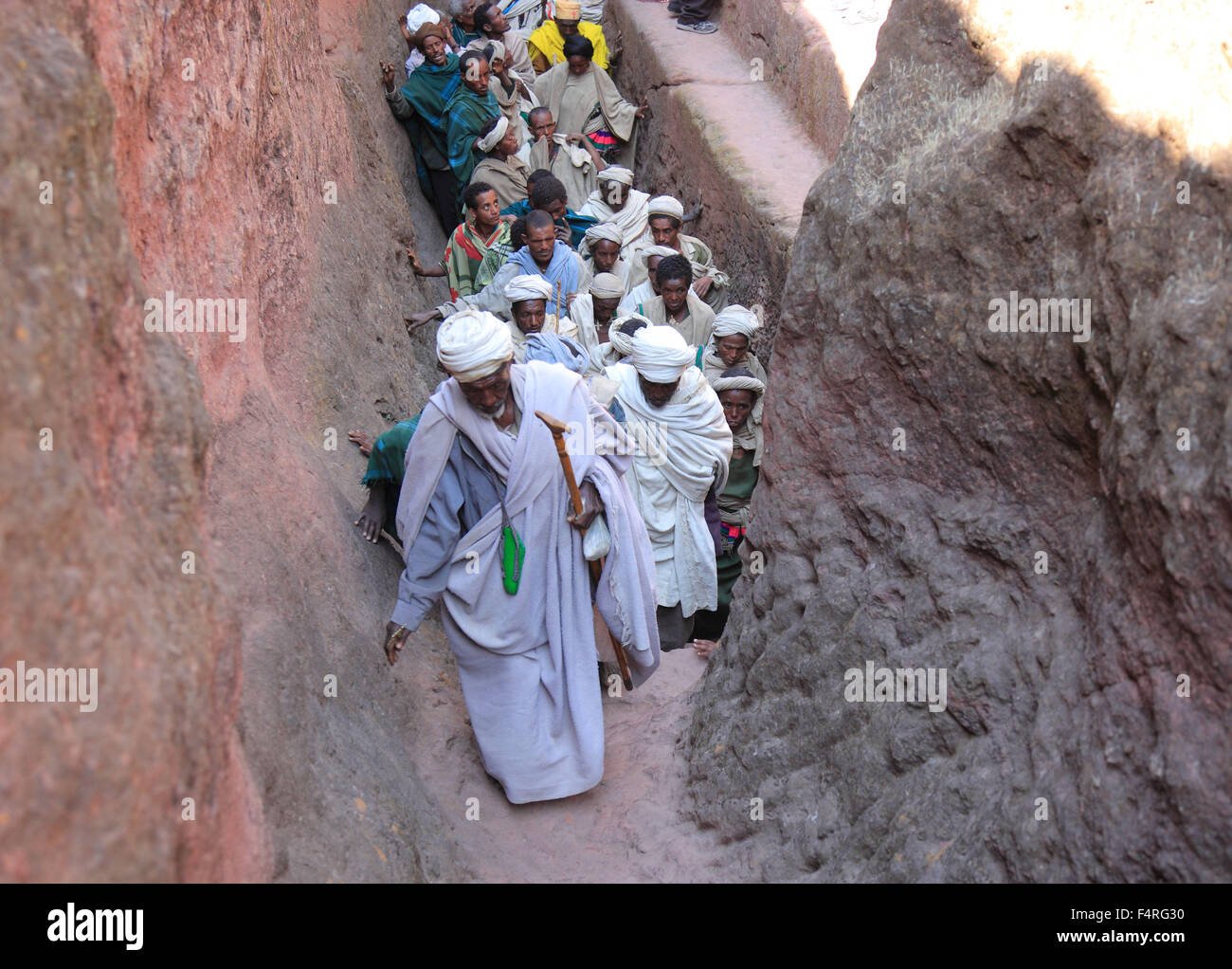Rock churches of Lalibela, pilgrims on the road between the rock ...