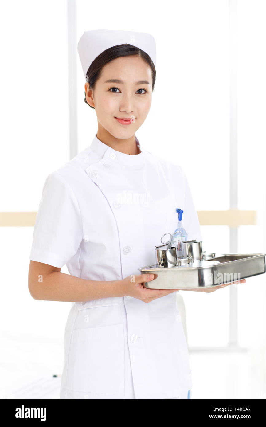 Young female nurse Stock Photo - Alamy