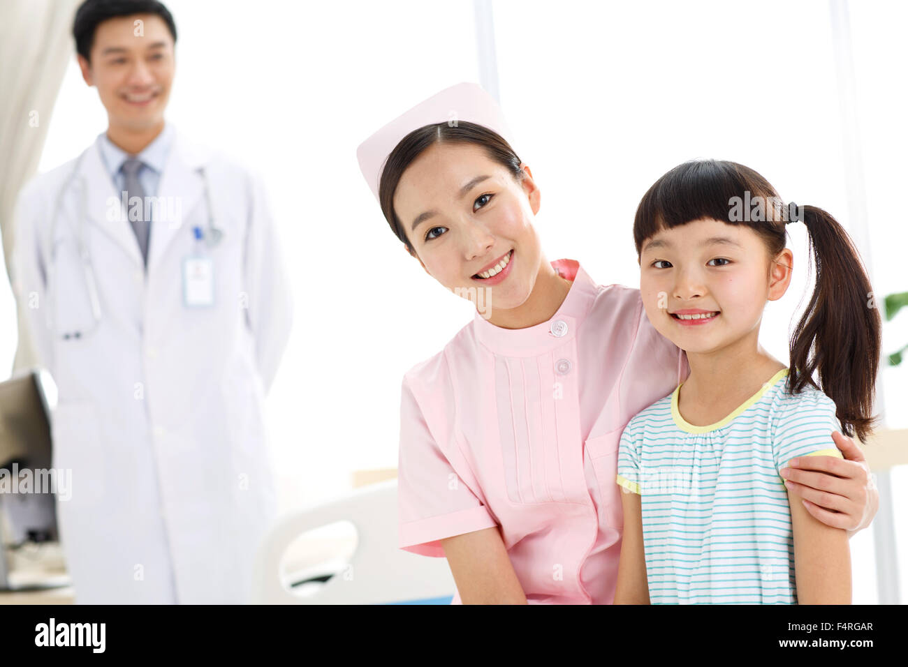 Health care workers and girls Stock Photo - Alamy