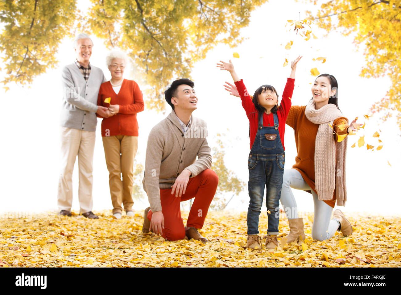 Happy family outdoor play Stock Photo - Alamy