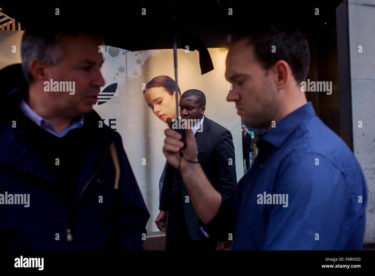 Model on an Adidas seemingly looks over her shoulder to watch passers ...