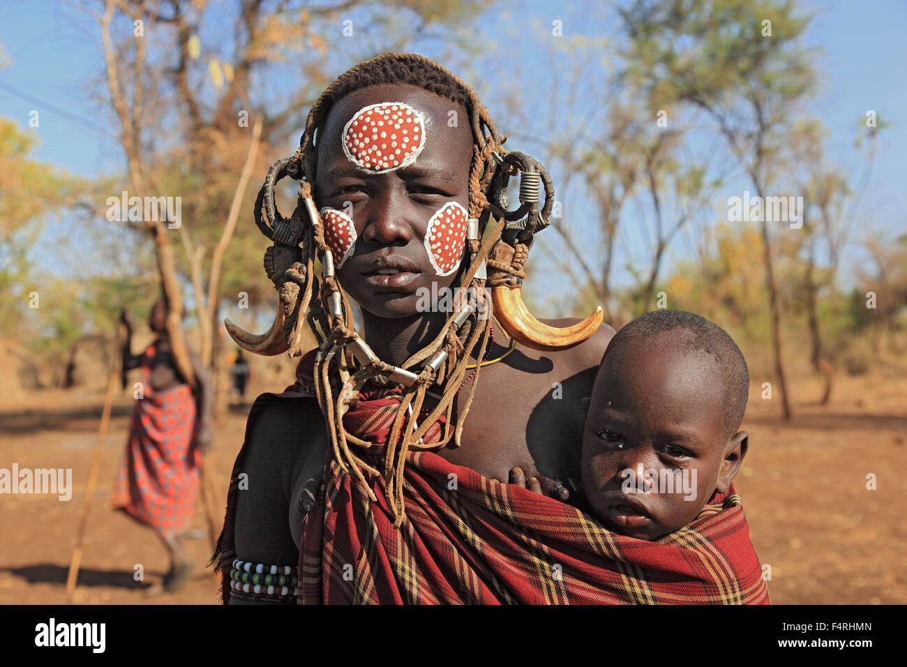 in Maco National Park, Mursi, Mursi Woman with Baby, painted skin and ...