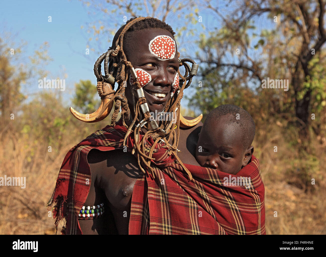 in Maco National Park, Mursi, Mursi Woman with Baby, painted skin and ...