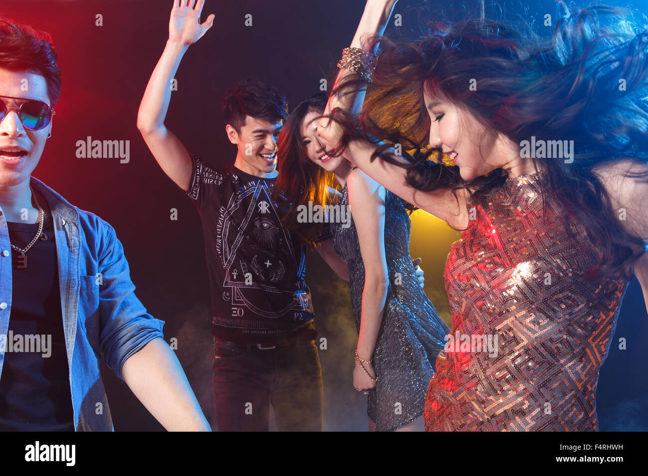 Young men and women dance in the bar Stock Photo - Alamy