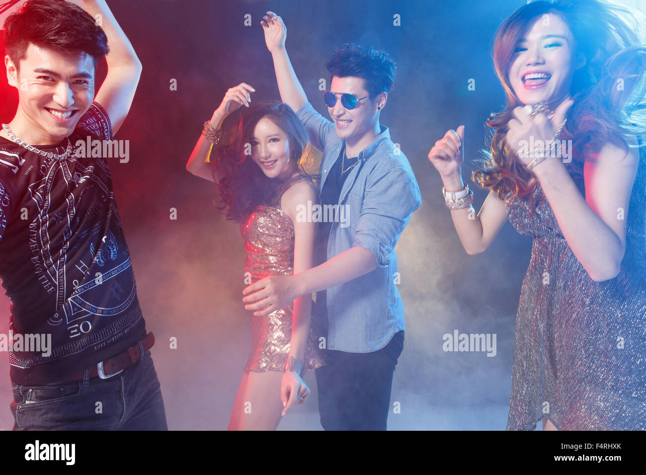 Young men and women dance in the bar Stock Photo - Alamy