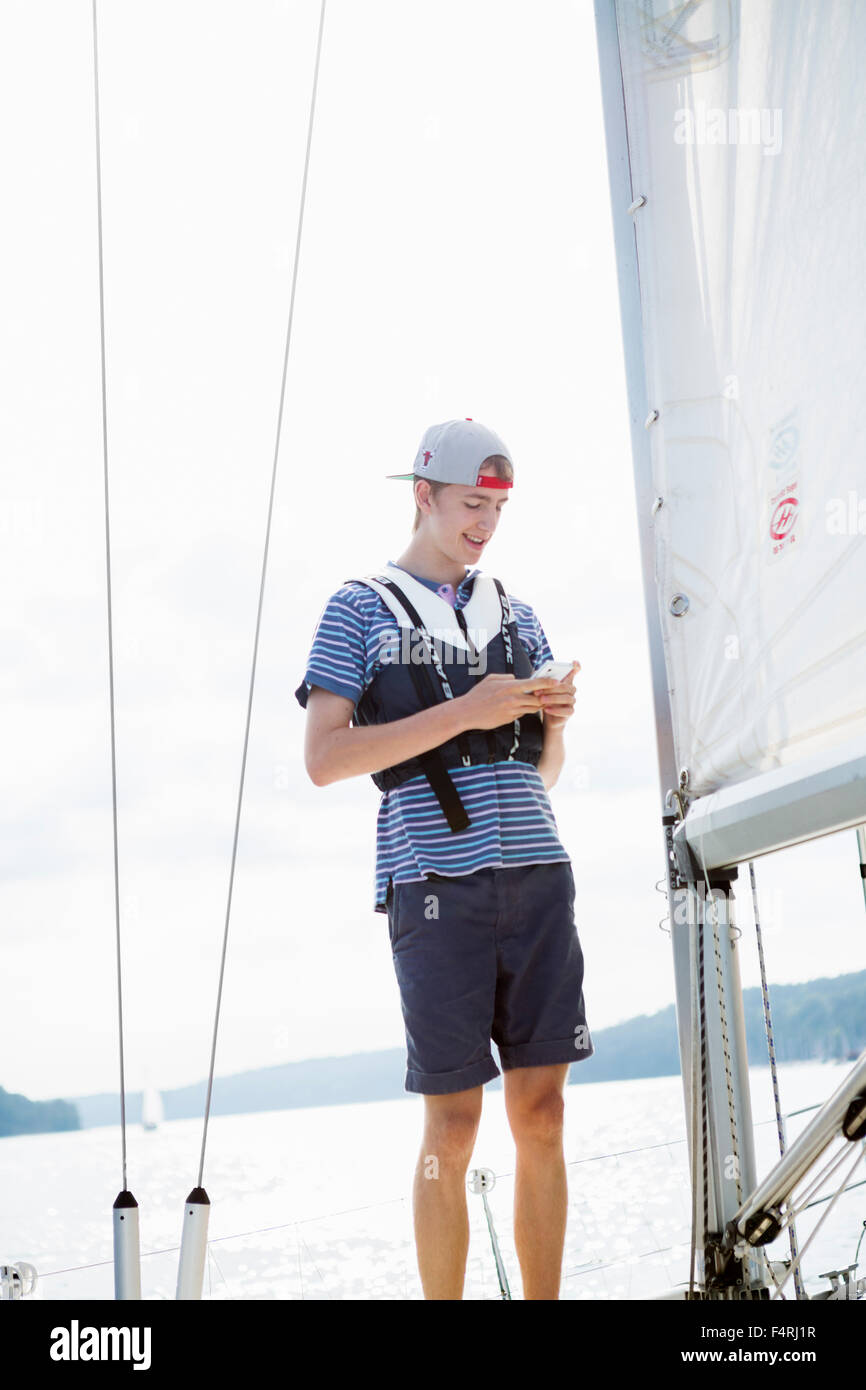 Man on sailboat hi-res stock photography and images - Alamy