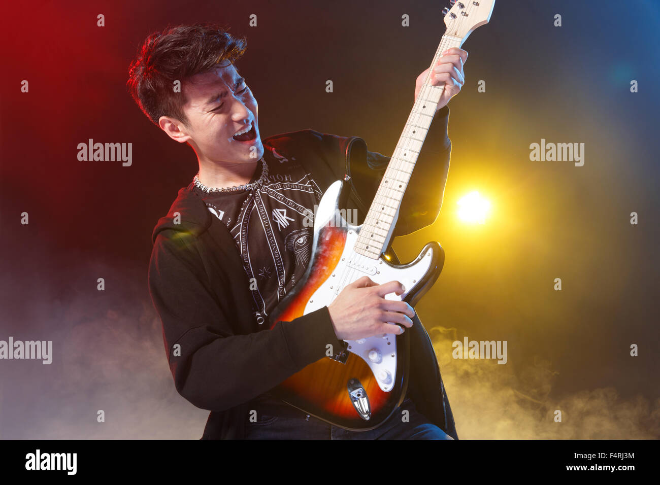Young men singing in the bar Stock Photo - Alamy