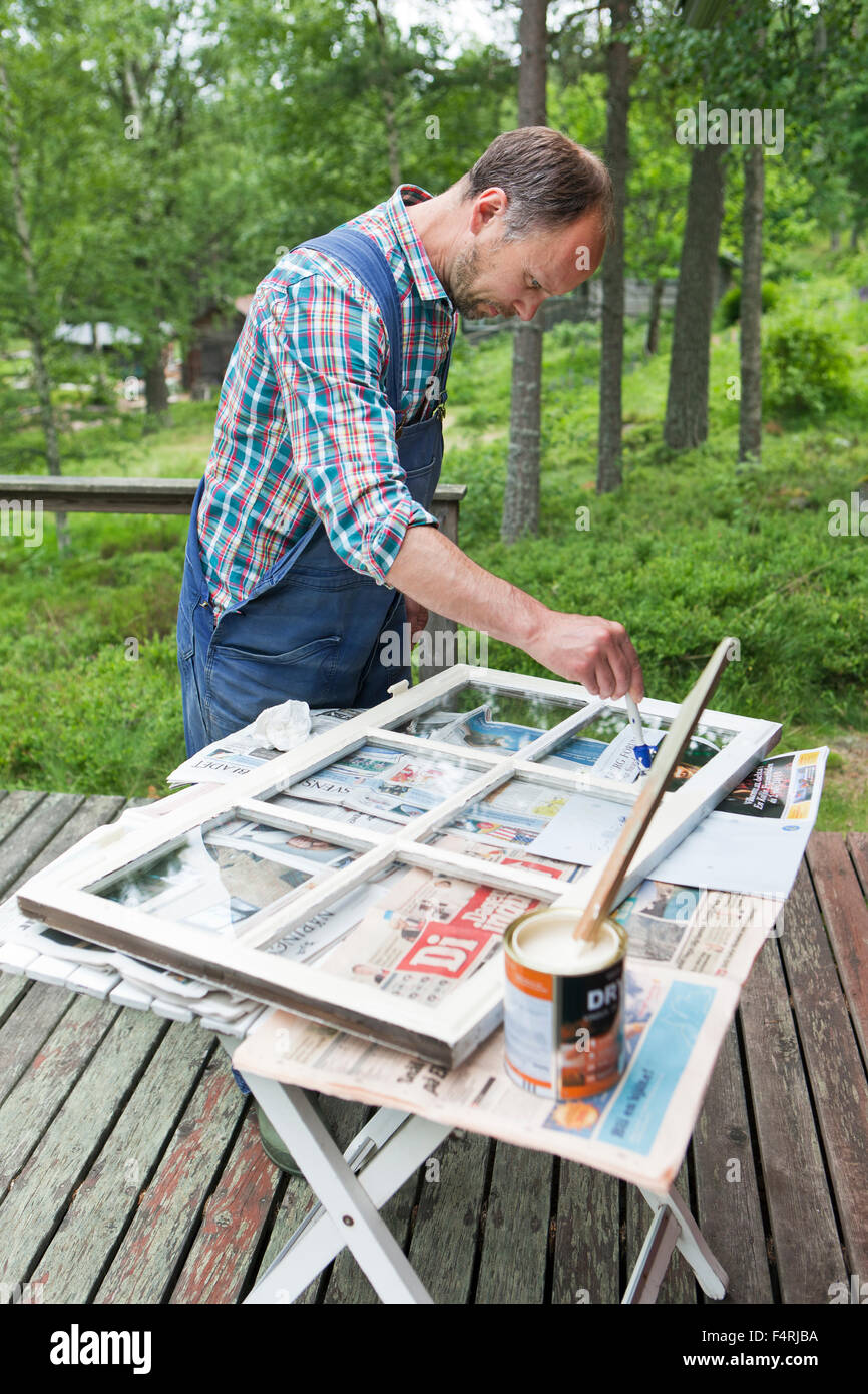 Man painting window hi-res stock photography and images - Alamy