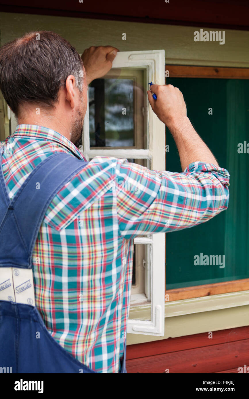 Man painting window hi-res stock photography and images - Alamy