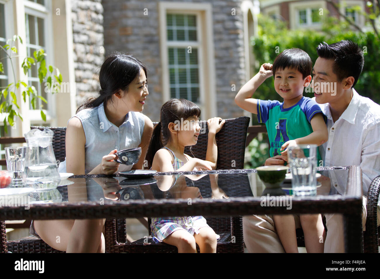 Happy family in the afternoon tea Stock Photo - Alamy