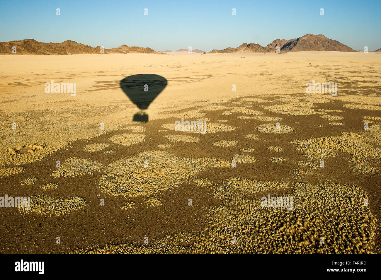 Balloon shadow. Hot Air Balloon flying over Sesriem Canyon, Namibia ...