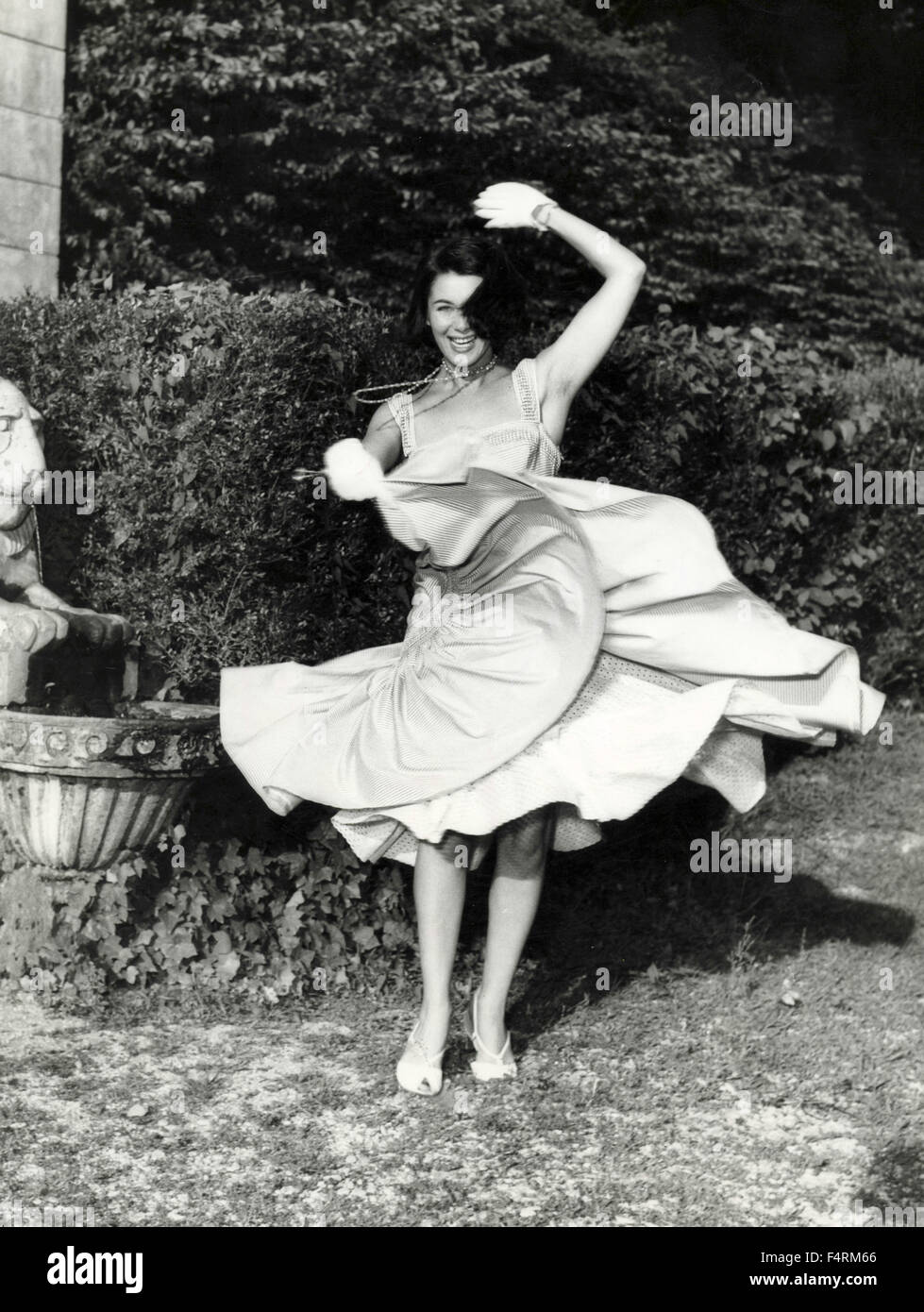 Italian actress Myriam Bru makes her skirt fly Stock Photo - Alamy