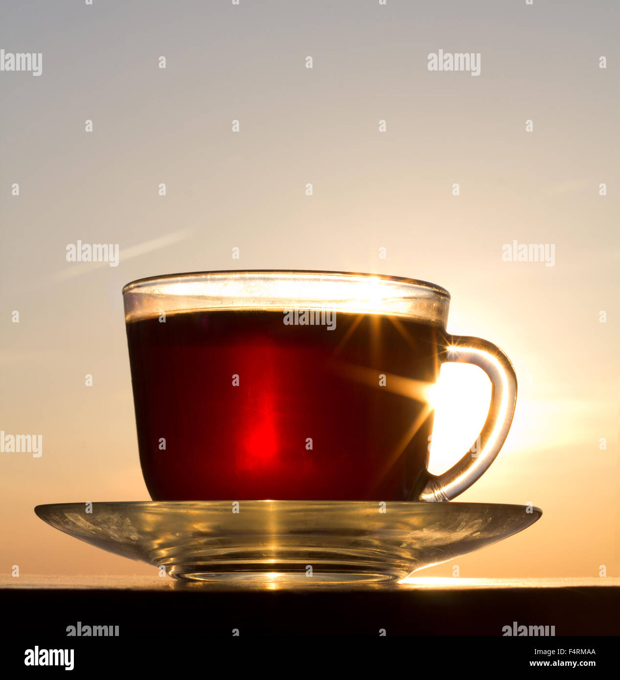 Tea cup in beams of the warm sun Stock Photo - Alamy