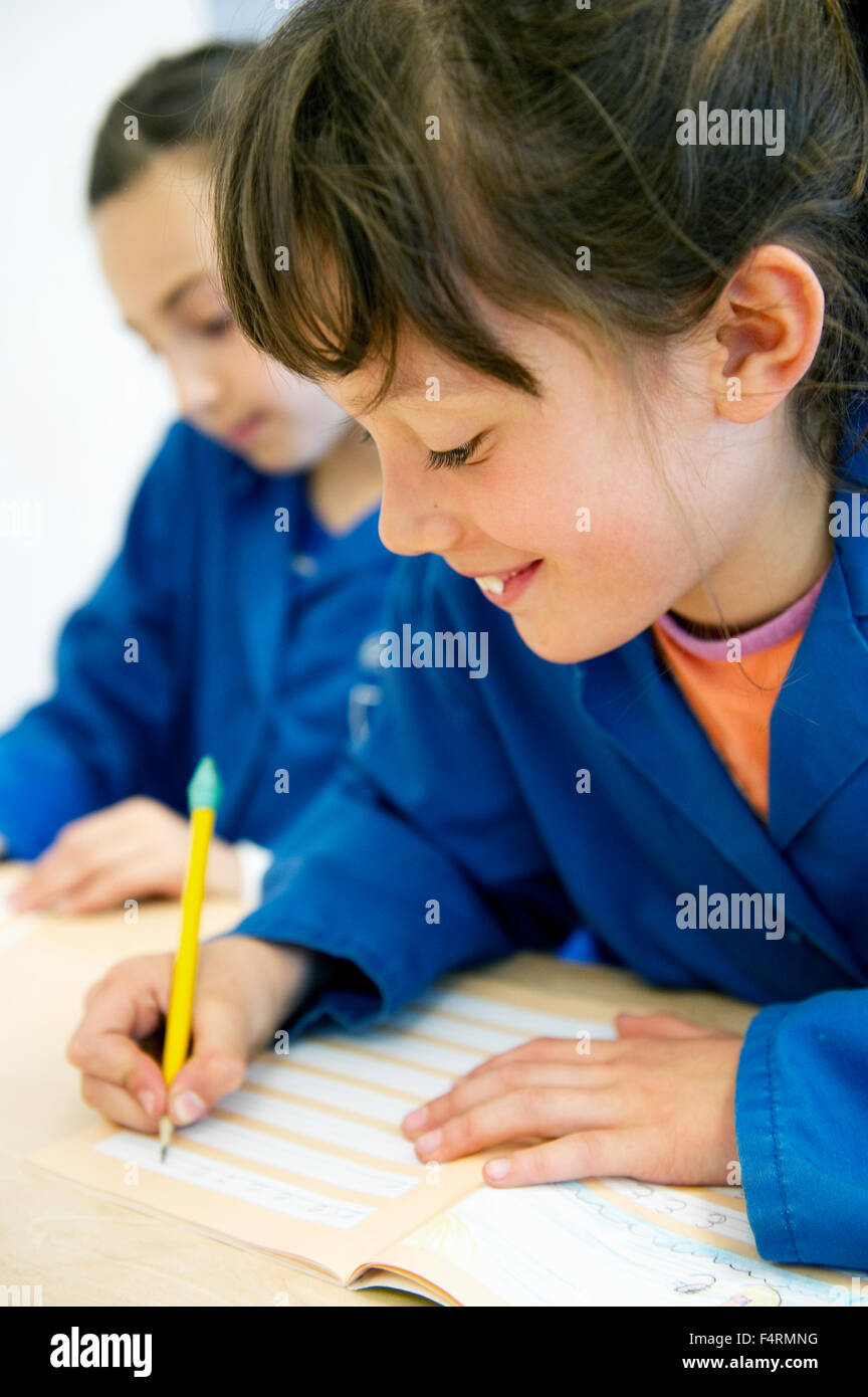 Two school girls in classroom hi-res stock photography and images - Alamy