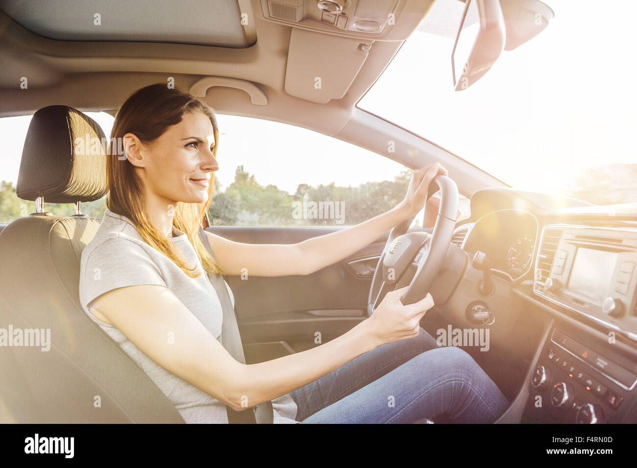 Young woman driving a car Stock Photo - Alamy
