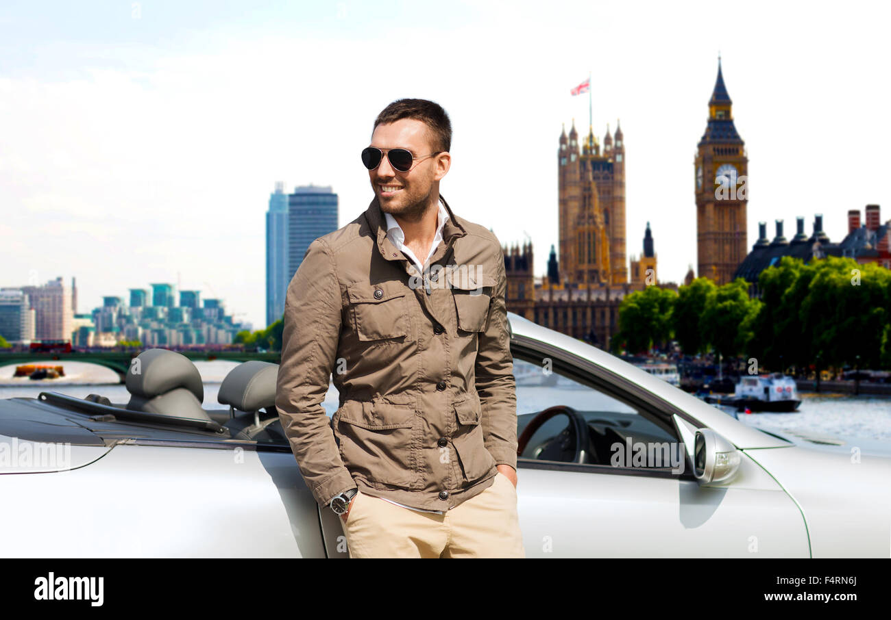 happy man near cabriolet car over london city Stock Photo - Alamy