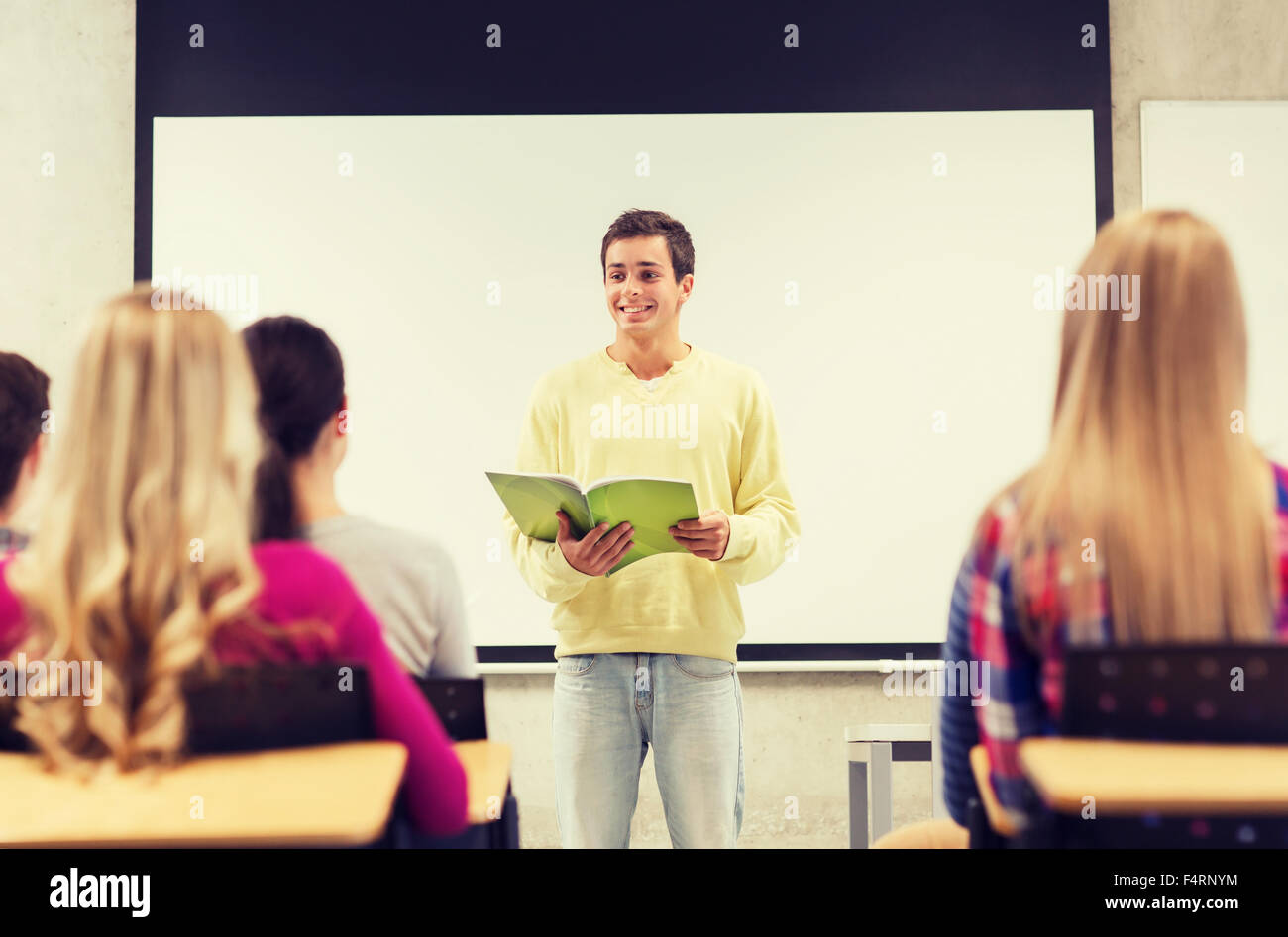 group of smiling students in classroom Stock Photo - Alamy