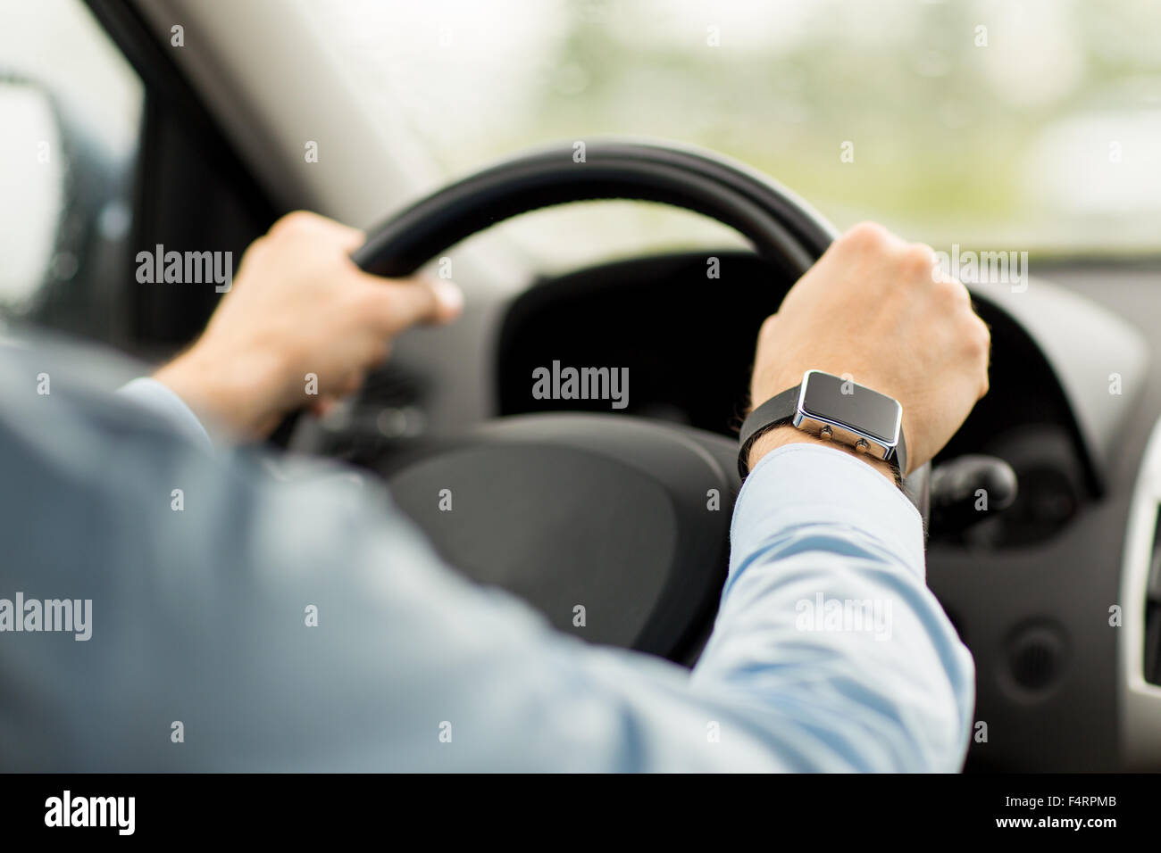 close up of man with wristwatch driving car Stock Photo - Alamy