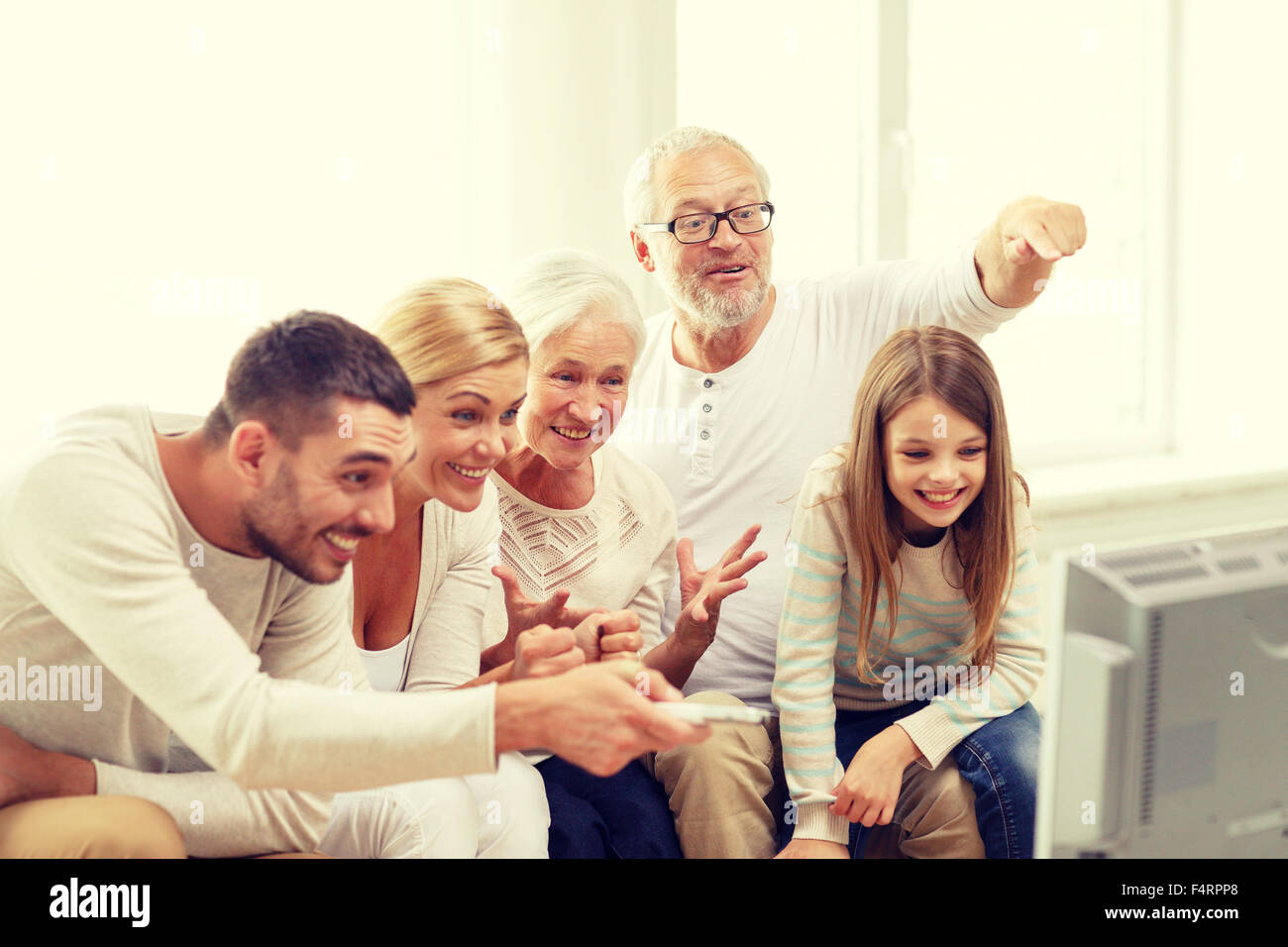 happy family watching tv at home Stock Photo - Alamy