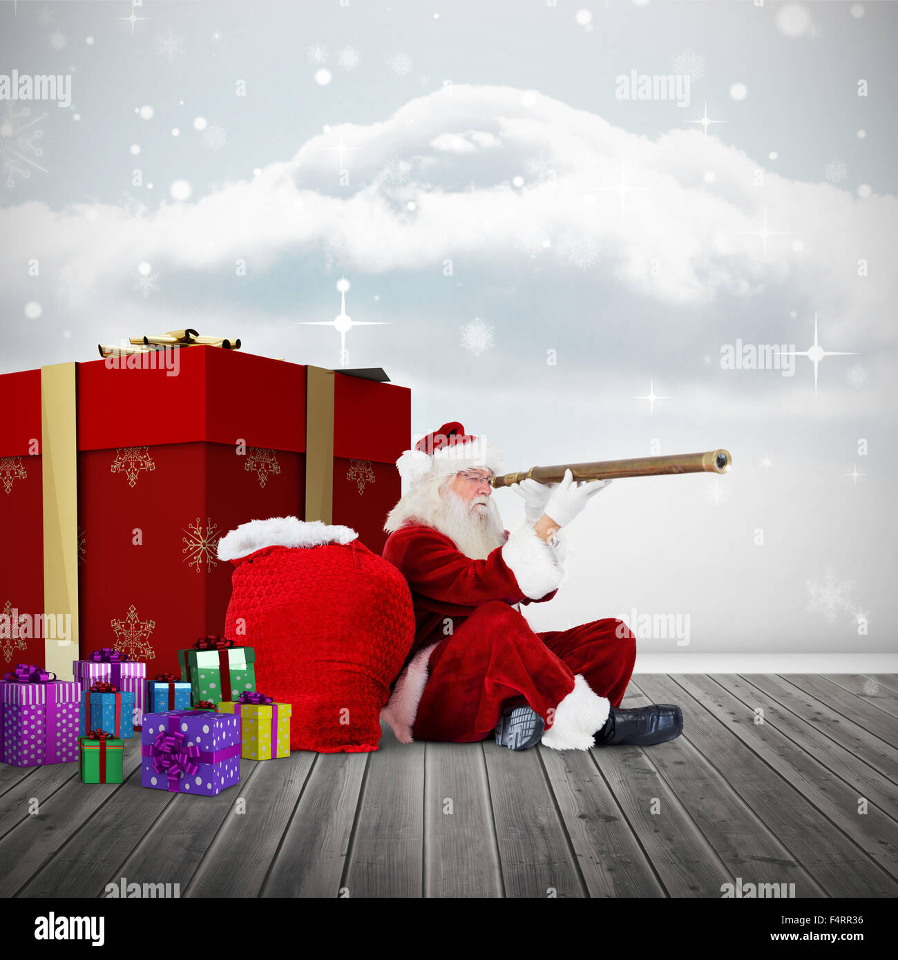 Composite image of santa looking through a telescope Stock Photo - Alamy