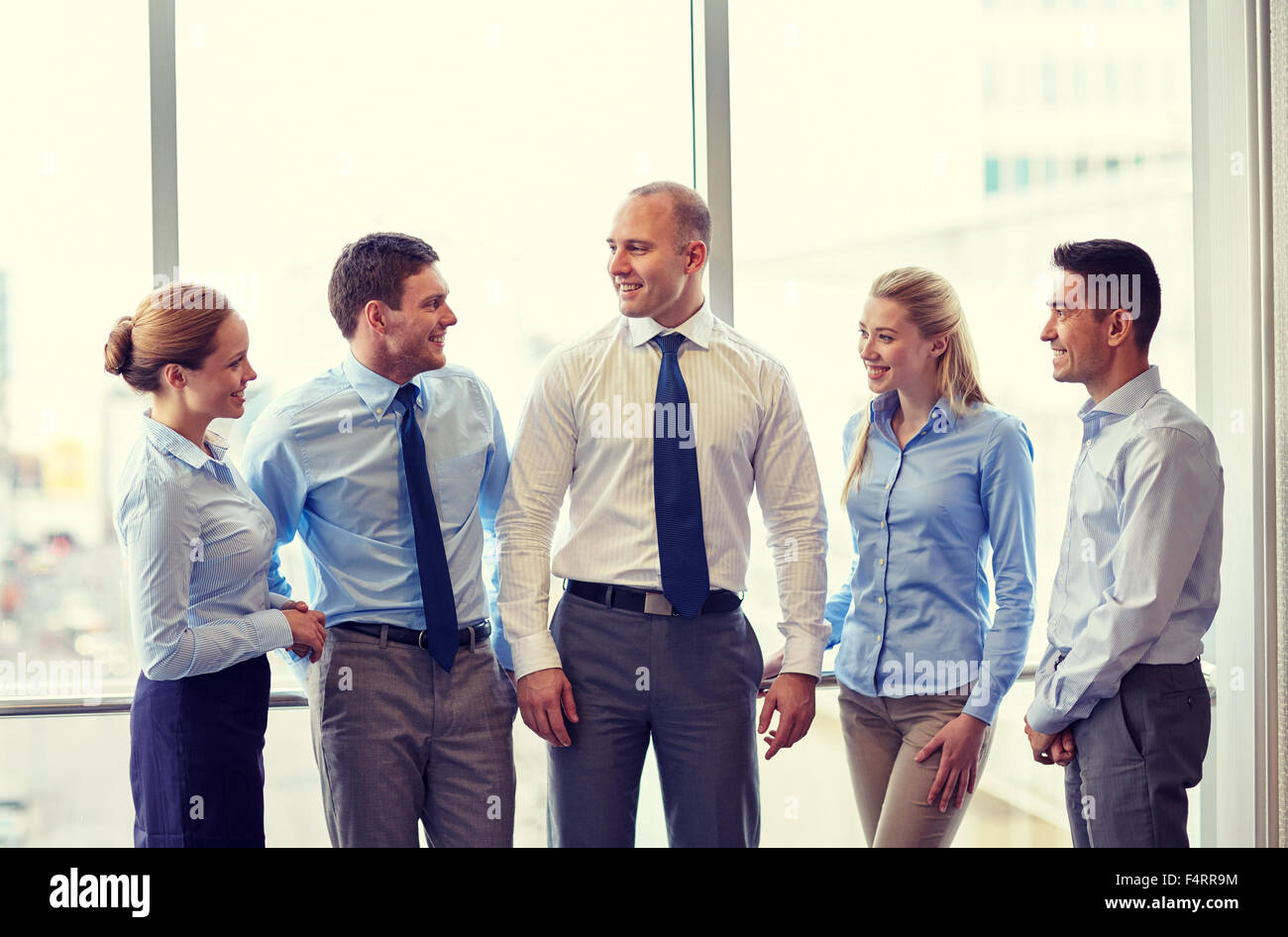 Co workers office talking hi-res stock photography and images - Alamy