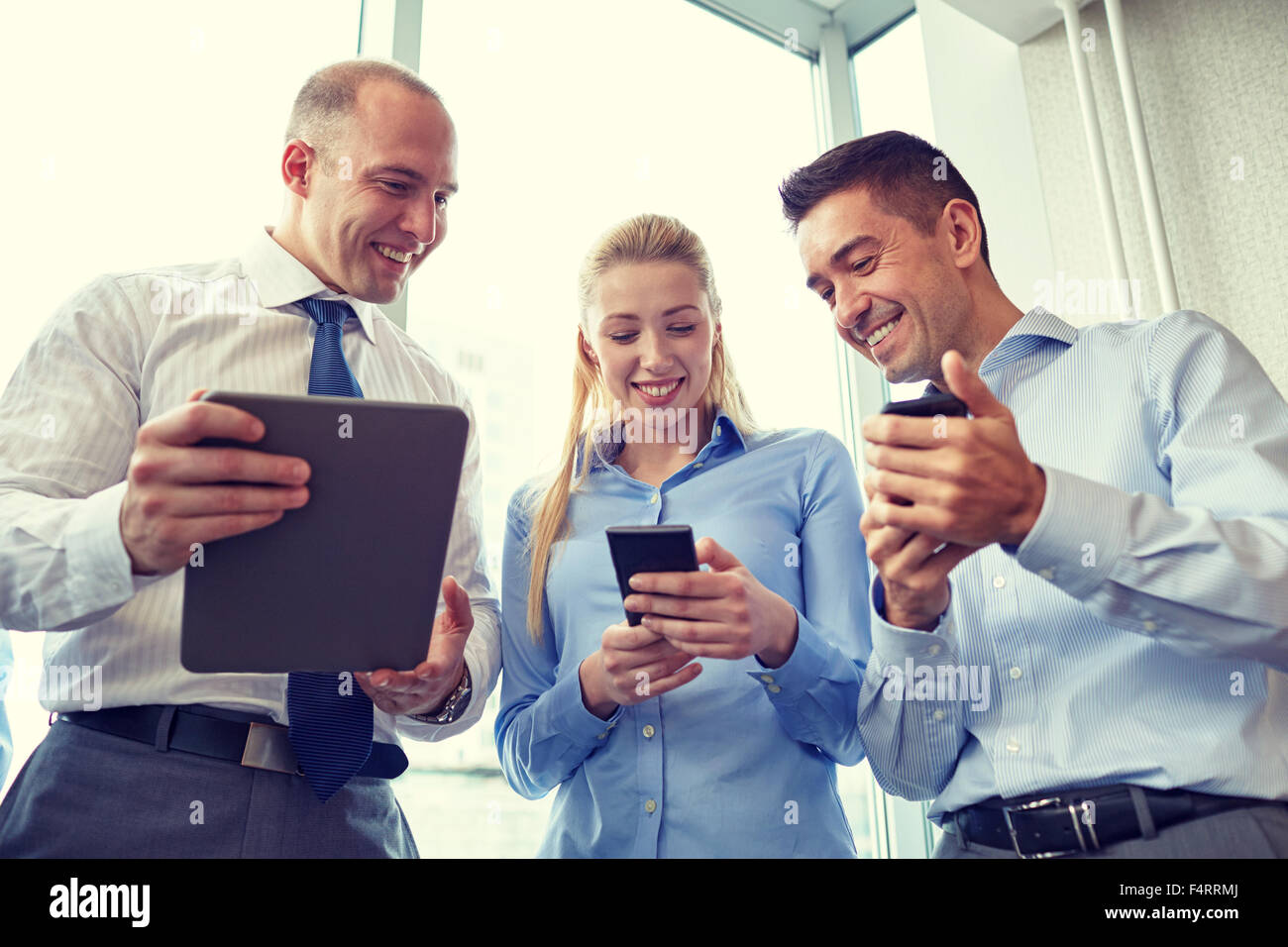 business people with tablet pc and smartphones Stock Photo - Alamy