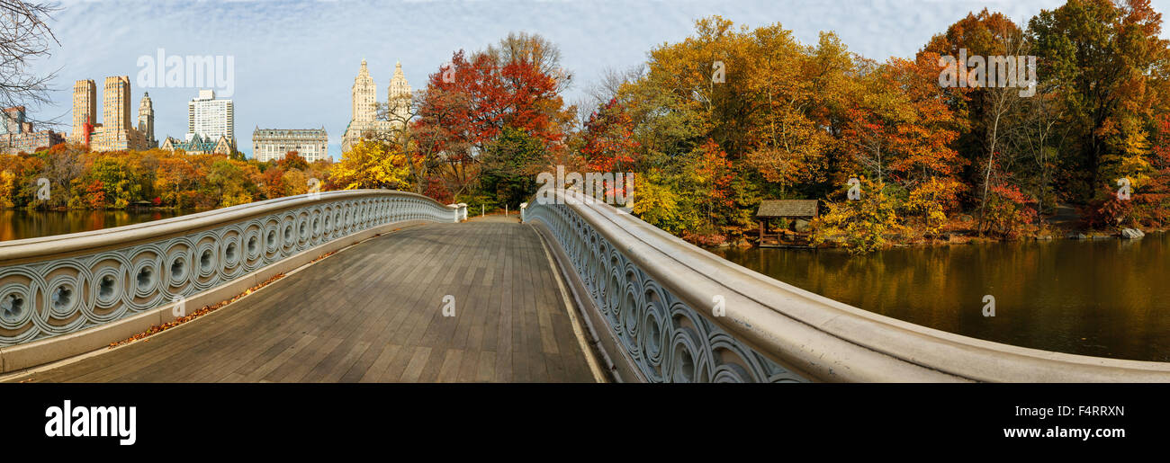 Panoramic of Central Park autumn trees from the Bow Bridge with view of ...