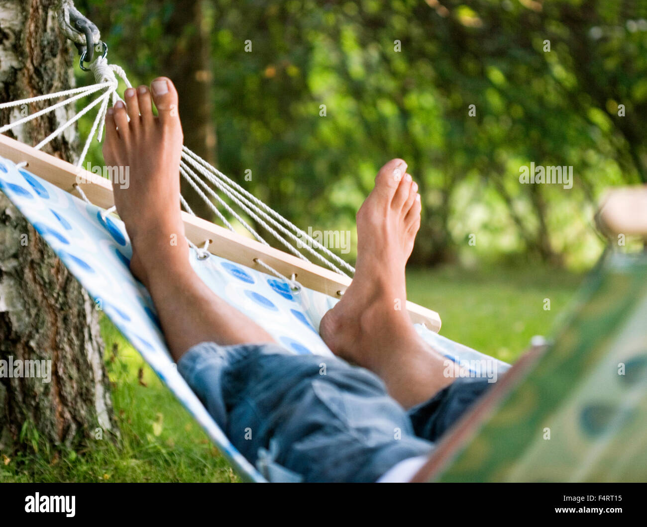 Man in hammock hi-res stock photography and images - Alamy