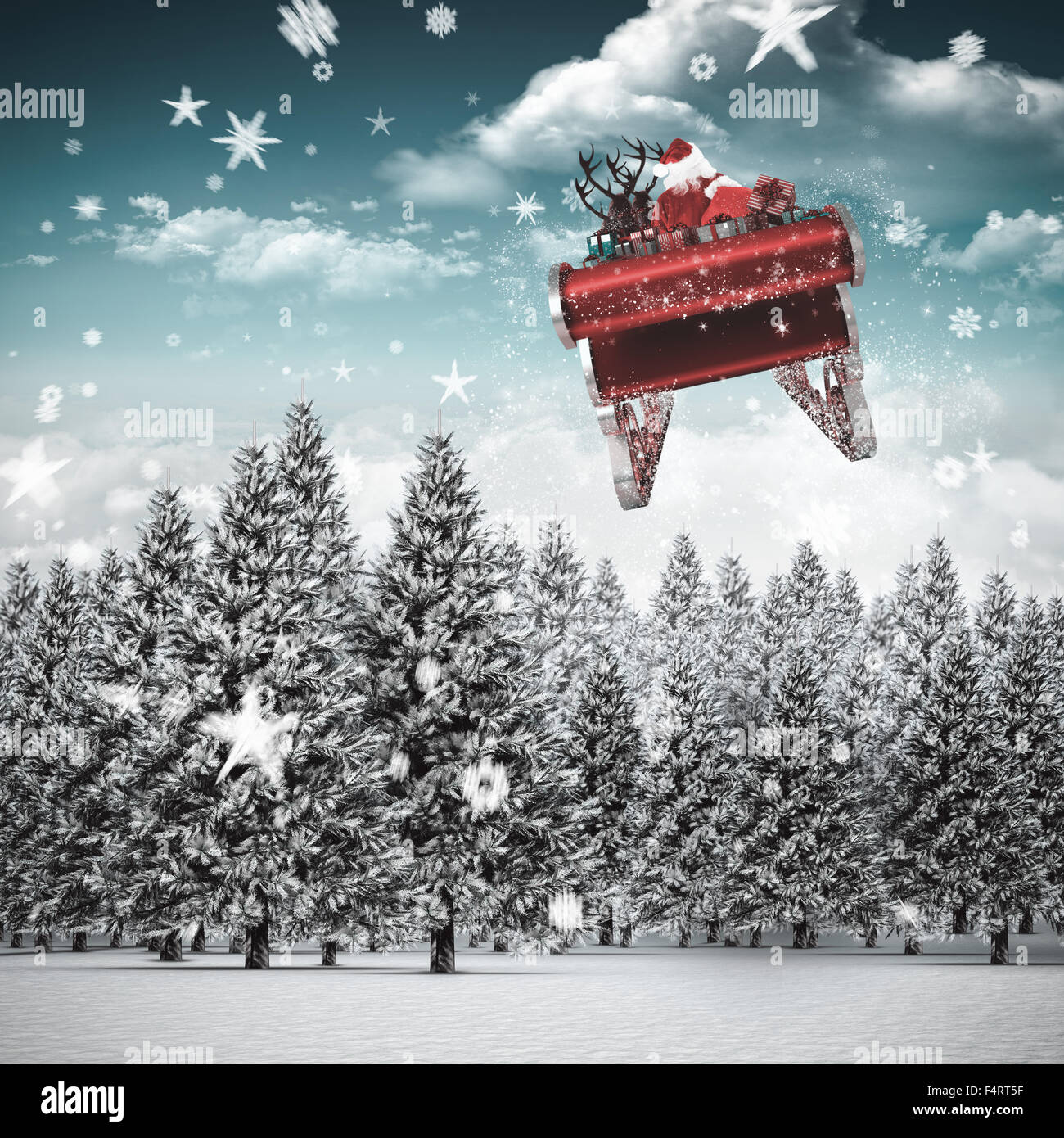 Composite image of santa flying his sleigh Stock Photo - Alamy